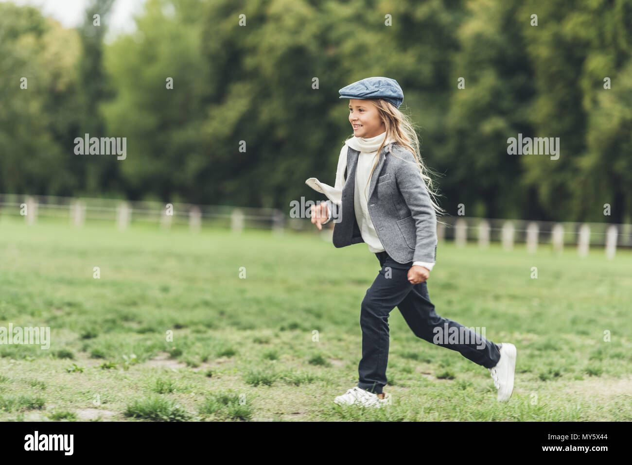 adorable blonde child running at countryside Stock Photo - Alamy
