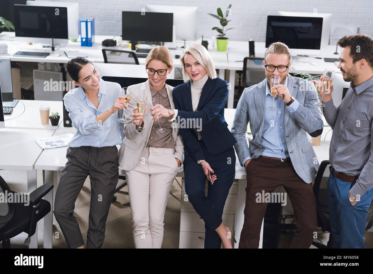 Business team drinking champagne hi-res stock photography and images ...