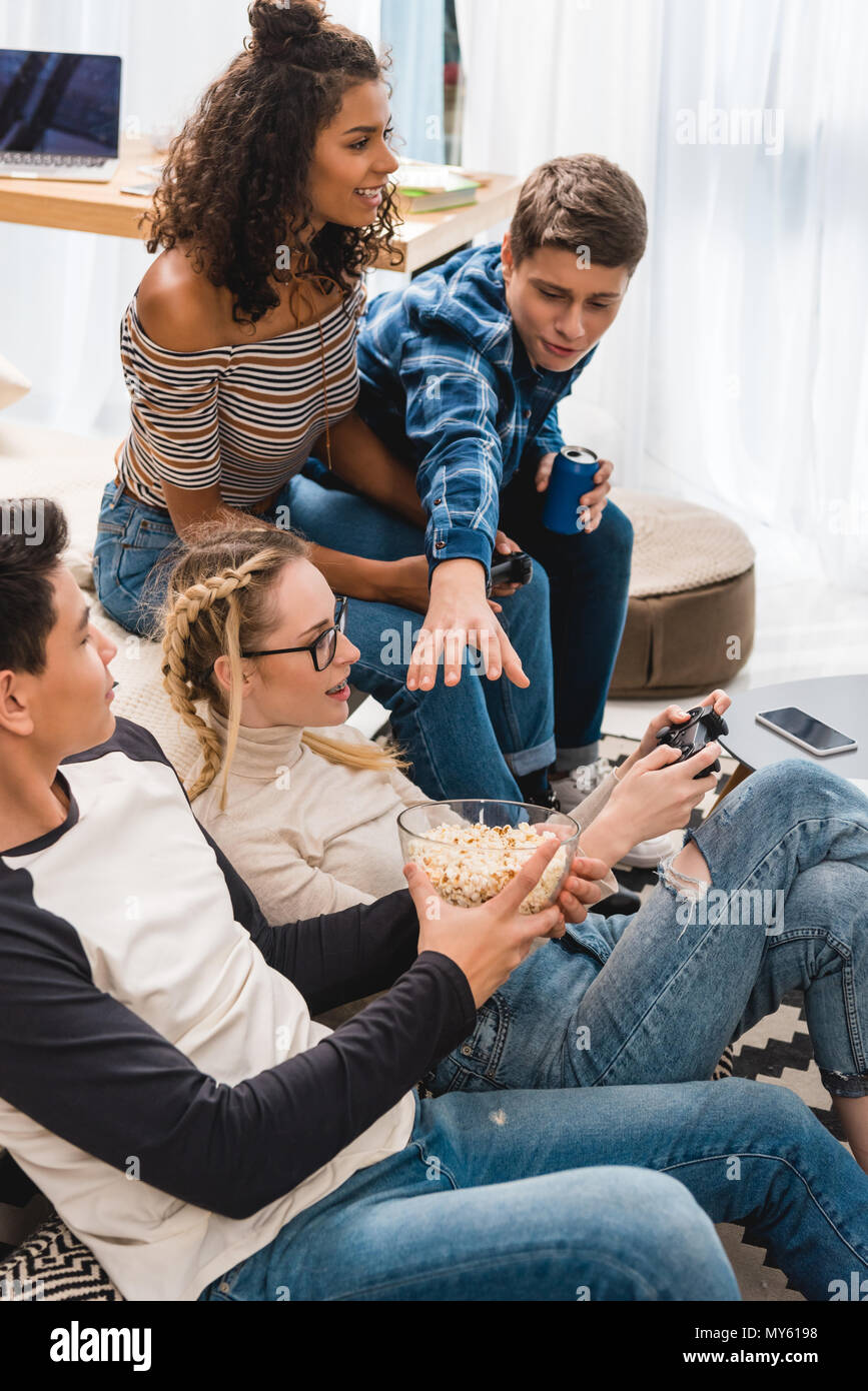 male teen reaching out for popcorn Stock Photo - Alamy