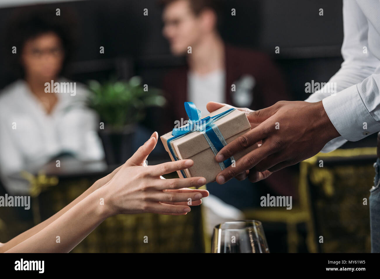 Woman taking gift from hi-res stock photography and images - Alamy