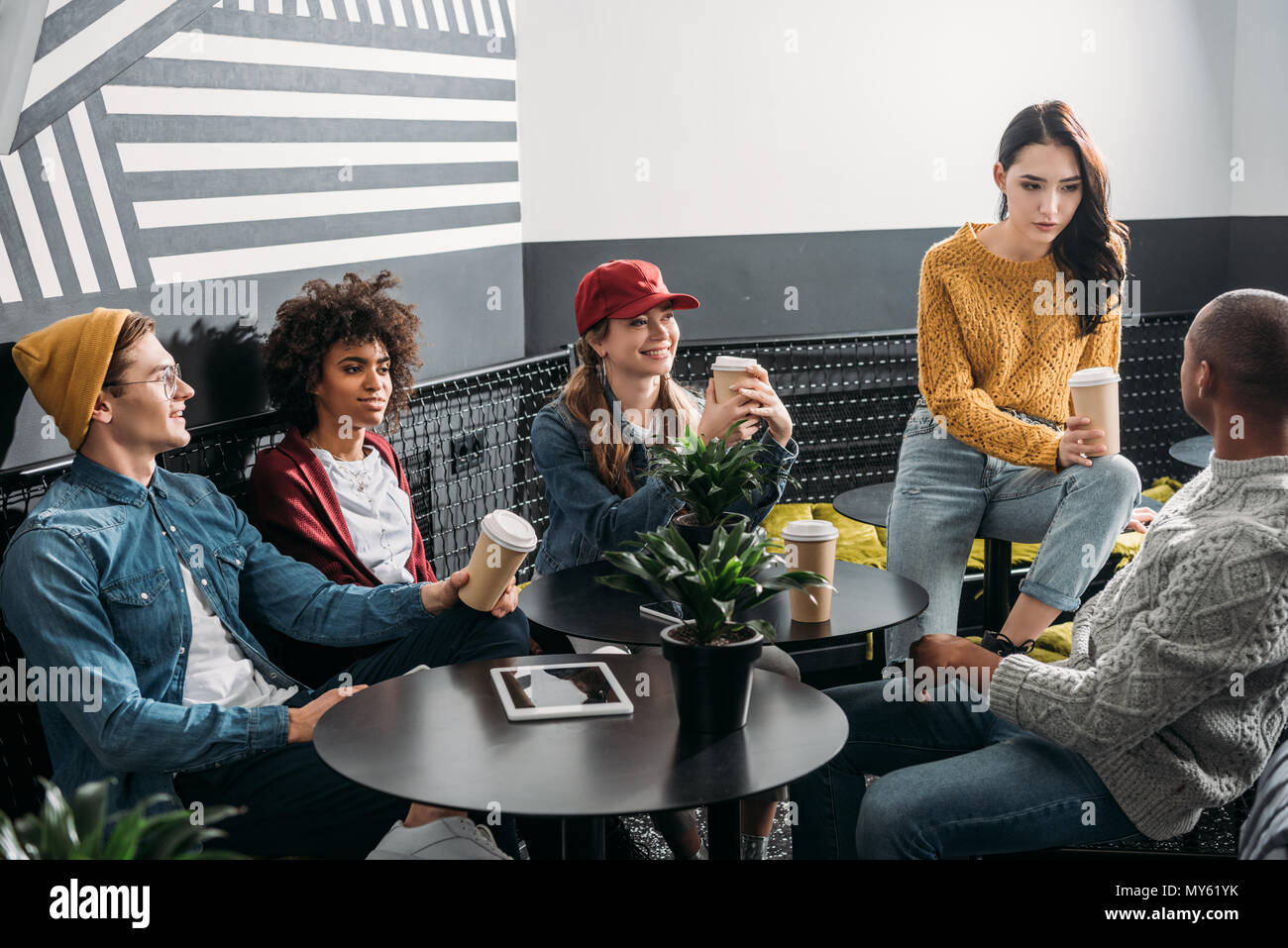 group of friends drinking coffee in modern stylish cafe Stock Photo - Alamy