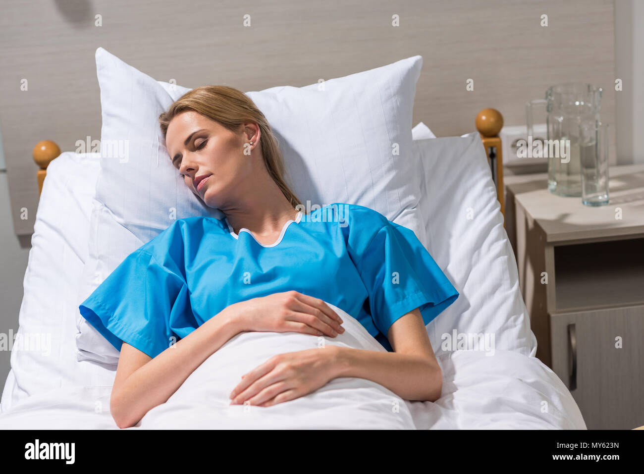 sick woman sleeping on hospital bed Stock Photo - Alamy