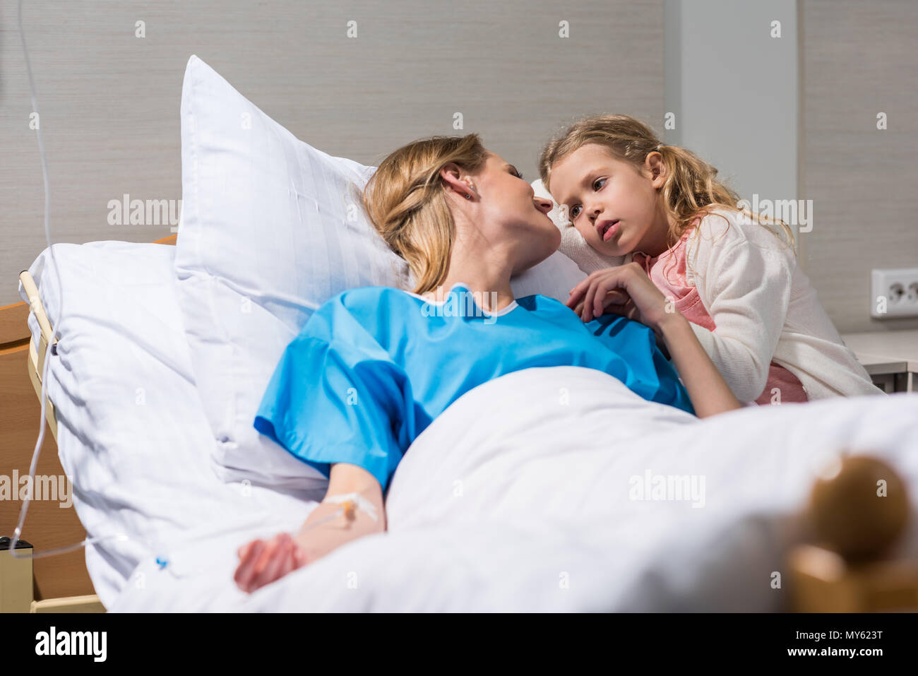 daughter spending time with sick mother at hospital Stock Photo - Alamy