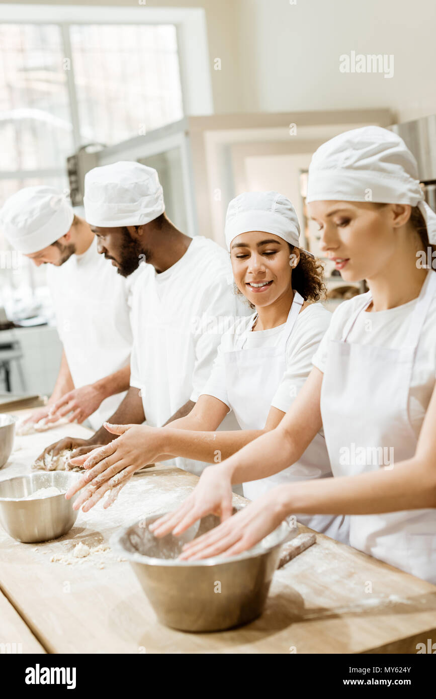 Group young baking manufacture hi-res stock photography and images - Alamy