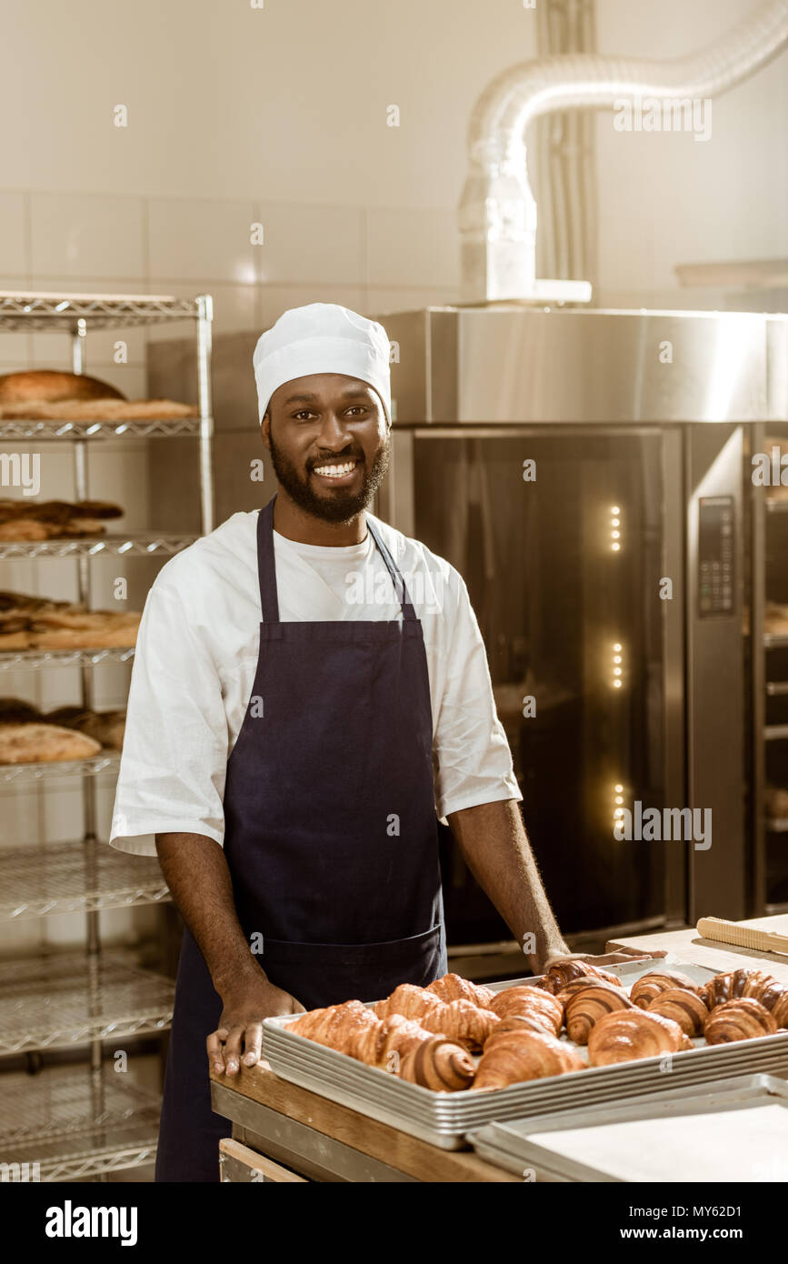 portrait of handsome african american baker at workplace on baking ...