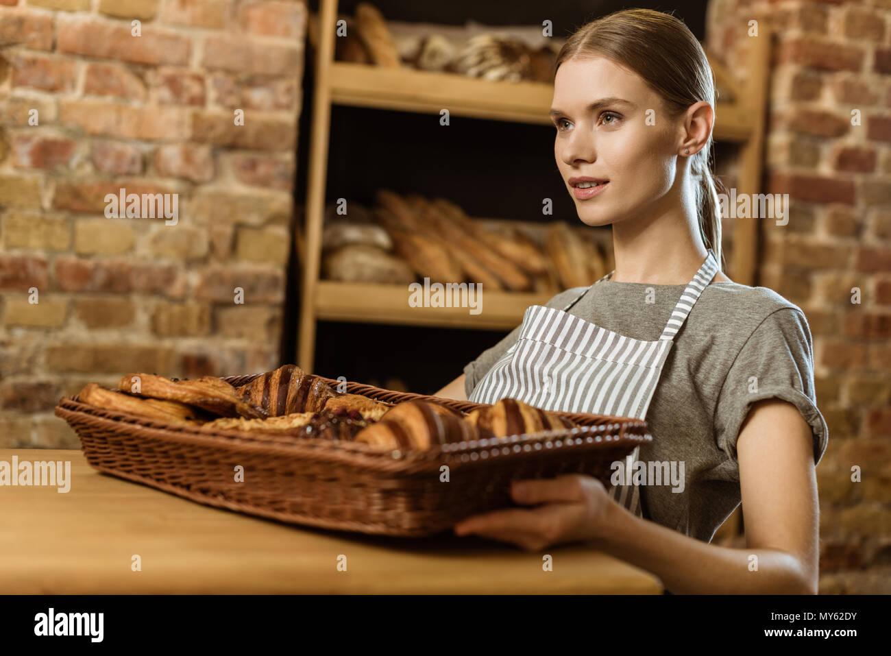 Female bakery worker basket hi-res stock photography and images - Alamy