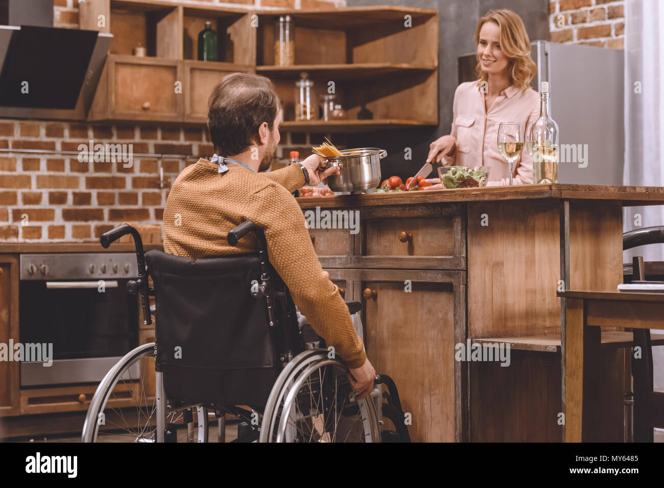 Wheelchair home cooking hi-res stock photography and images - Alamy