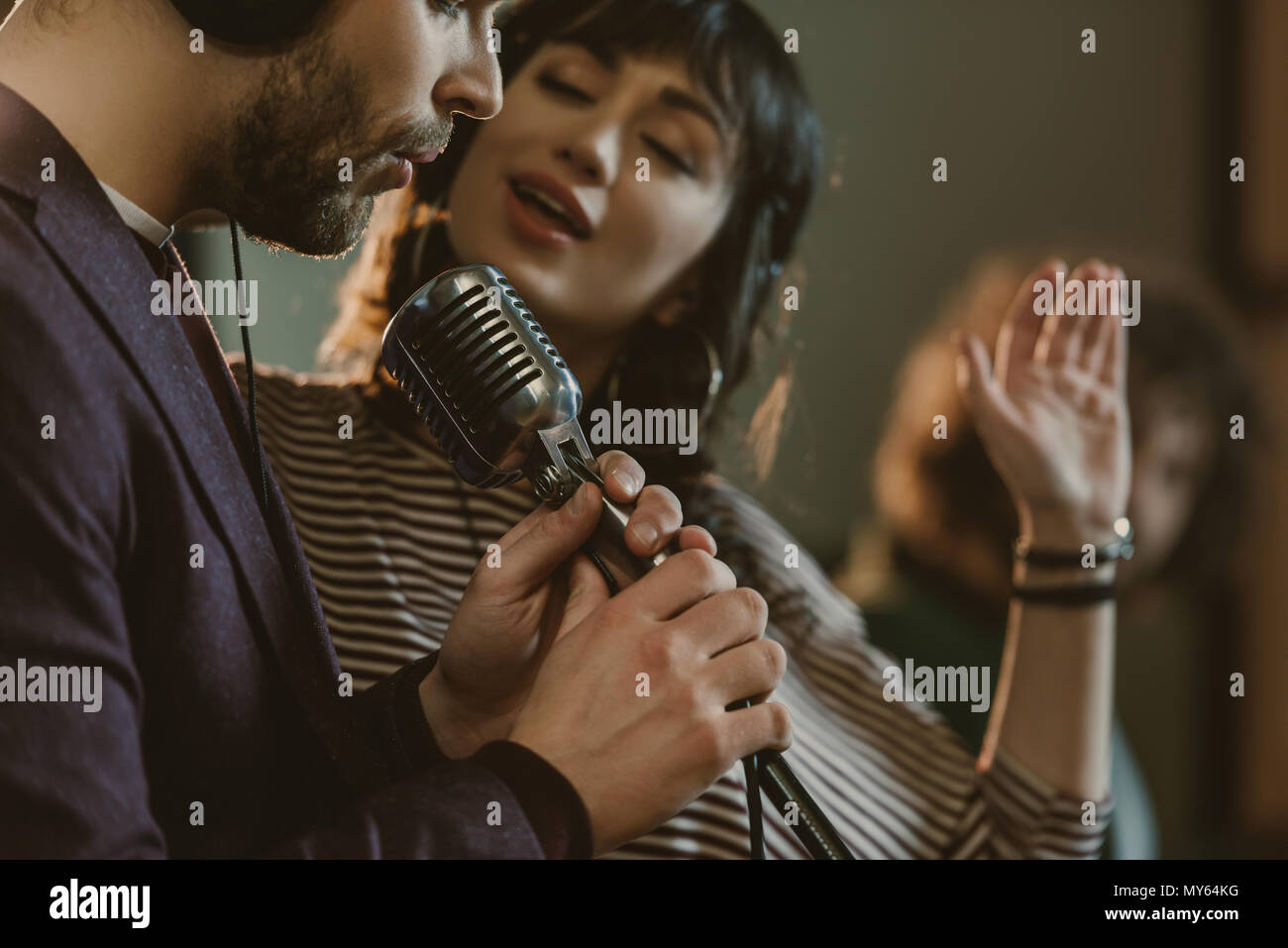 close-up shot of singers performing song together Stock Photo - Alamy