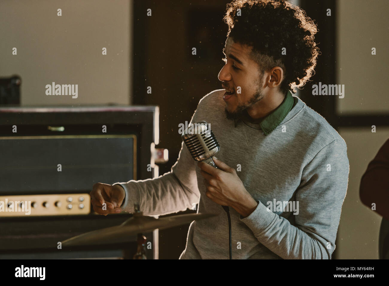 handsome african american singer performing song with microphone Stock ...