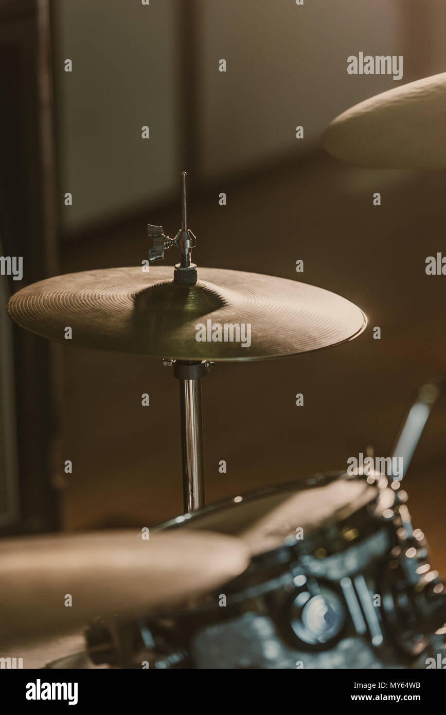 close-up shot of drum cymbals under spotlight on stage Stock Photo - Alamy