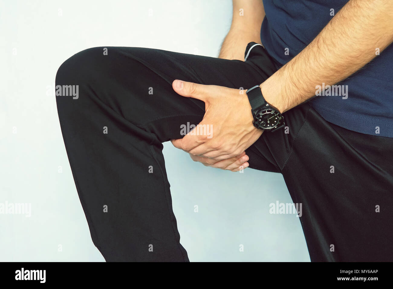 Muscle injury. Man with sprain thigh muscles. Athlete in sports shorts ...