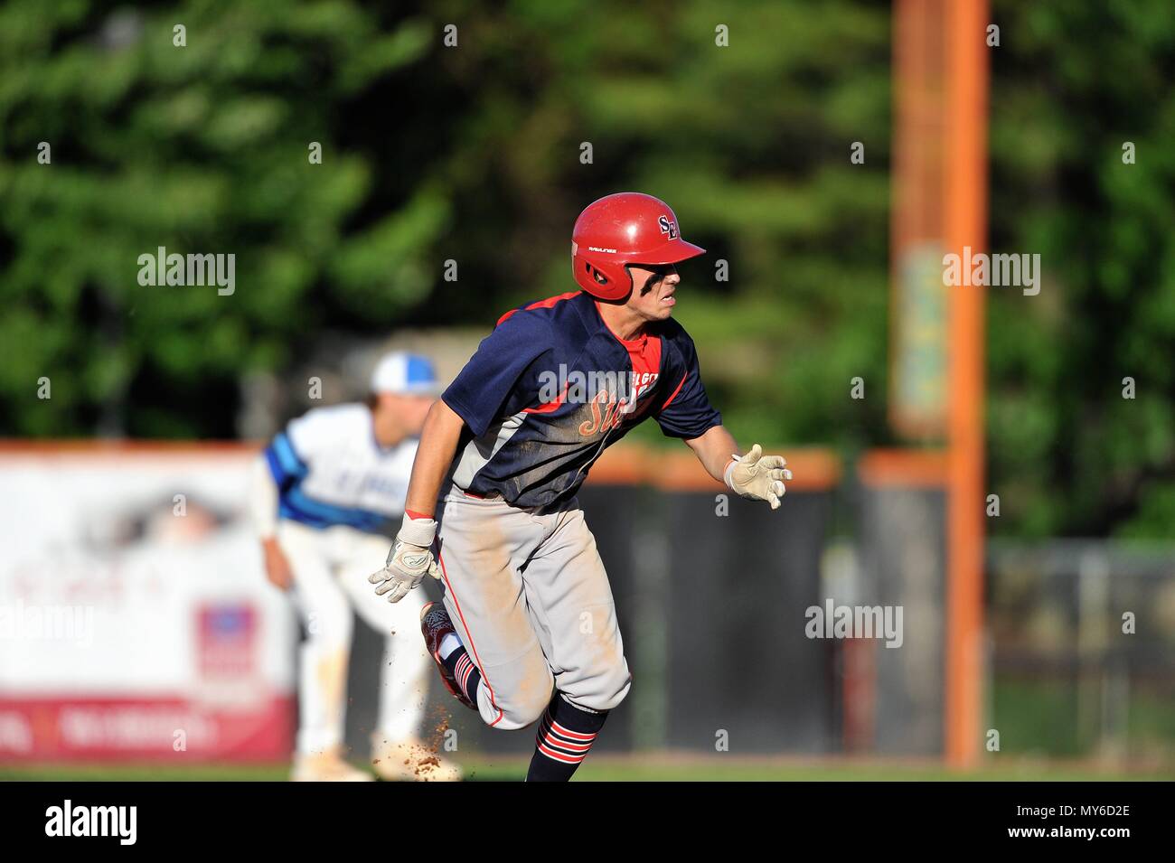 High school baseball game runner taking lead off base sports hi-res ...