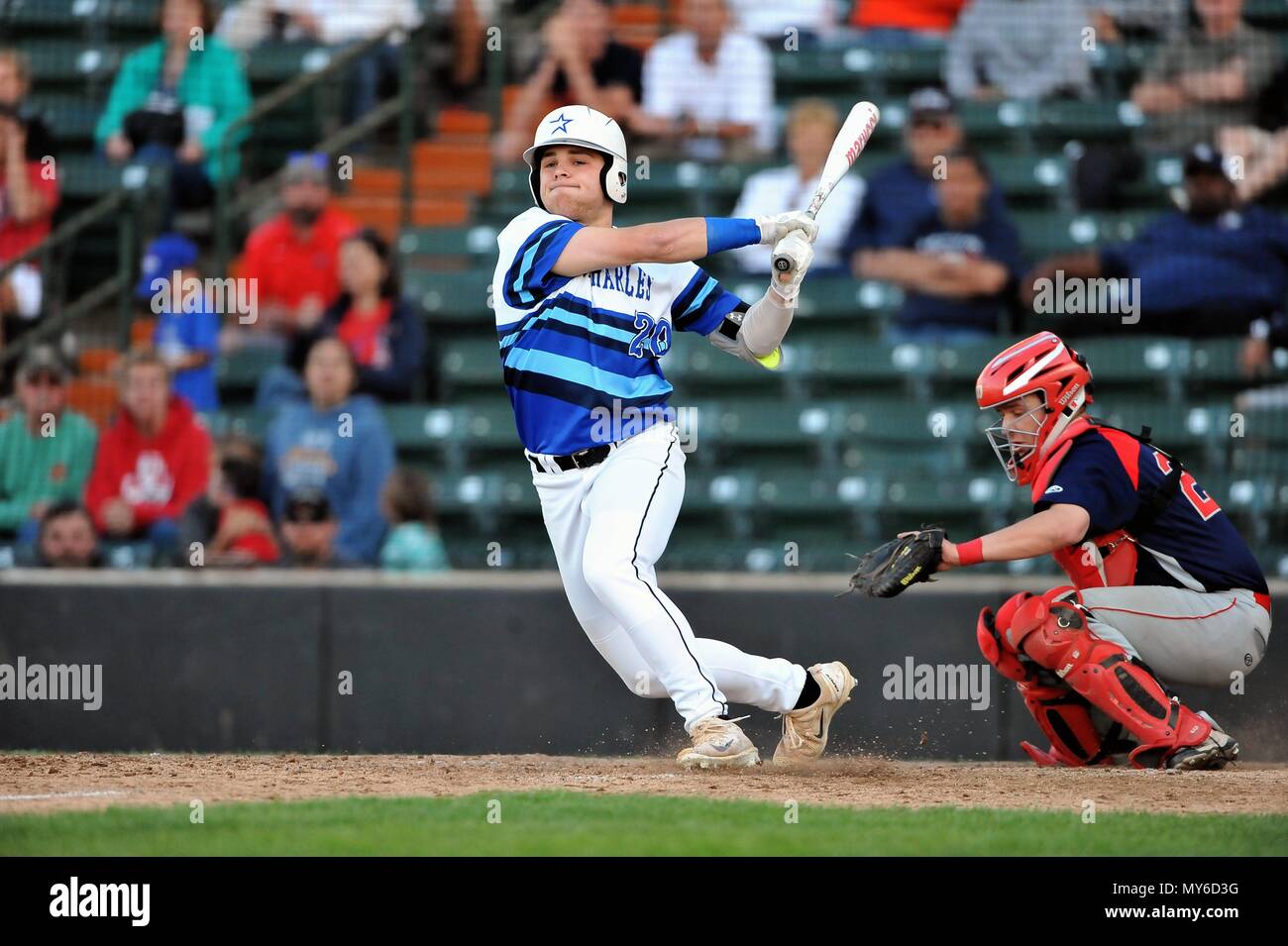 Batter following through after making contact with a pitch. USA Stock ...