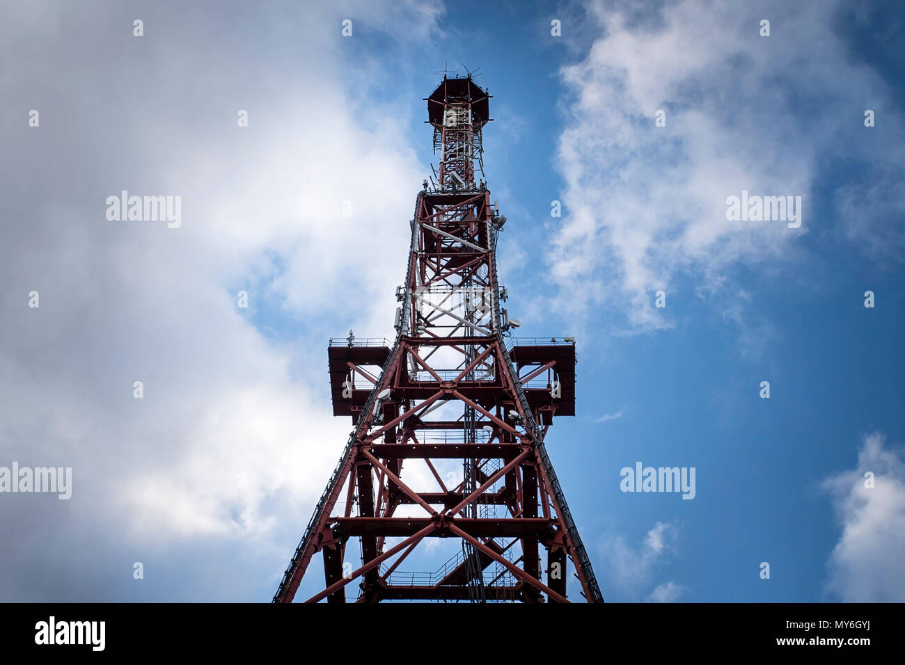 Telecommunication towers include of radio microwave and television antenna system with cloud ...
