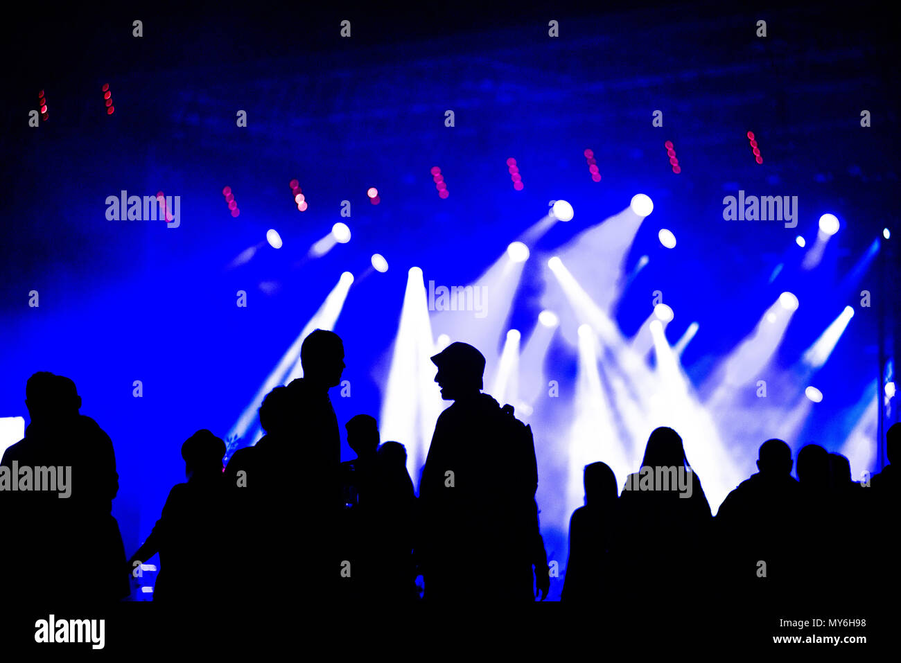 Silhouette of crowd of people socializing during music festival Stock ...