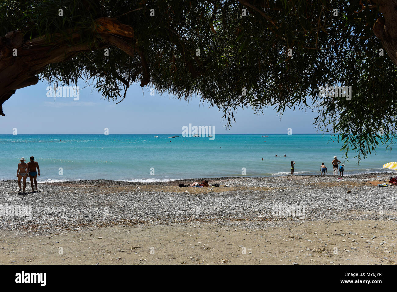 PISSOURI BAY, CYPRUS - JUNE 10, 2017: Tourists relaxing, sunbathing and ...