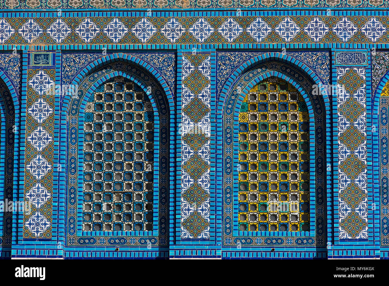 Colorful Islamic patterns, window covered with Arabic screen, mosaic ...