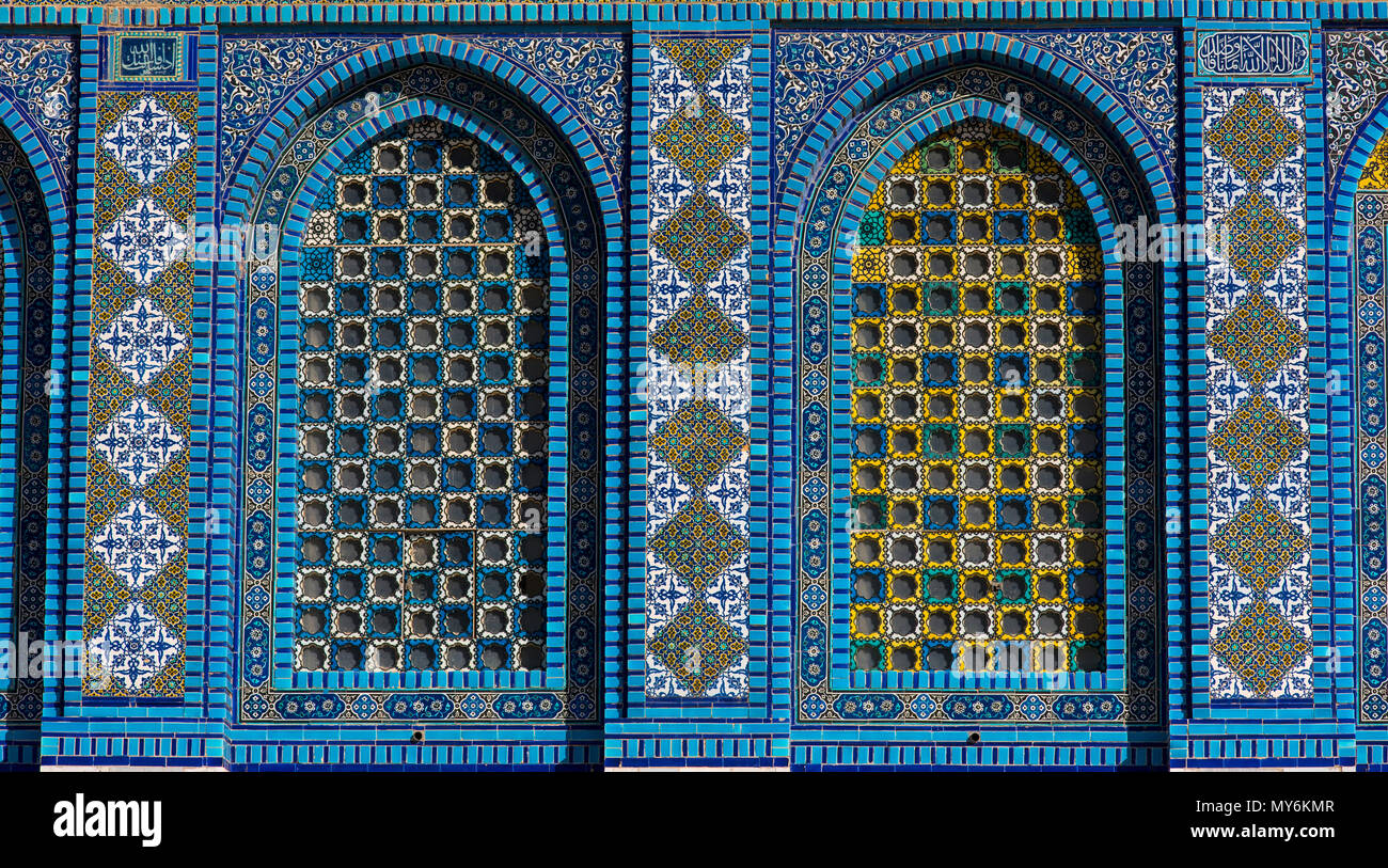 Colorful Islamic patterns, window covered with Arabic screen, mosaic ...