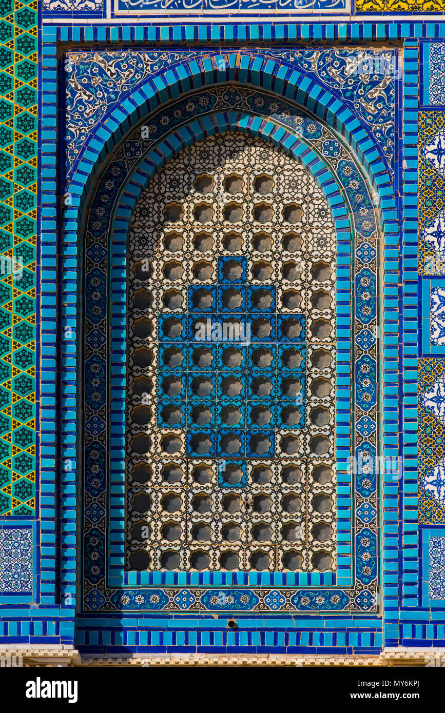 Colorful Islamic patterns, window covered with Arabic screen, mosaic ...