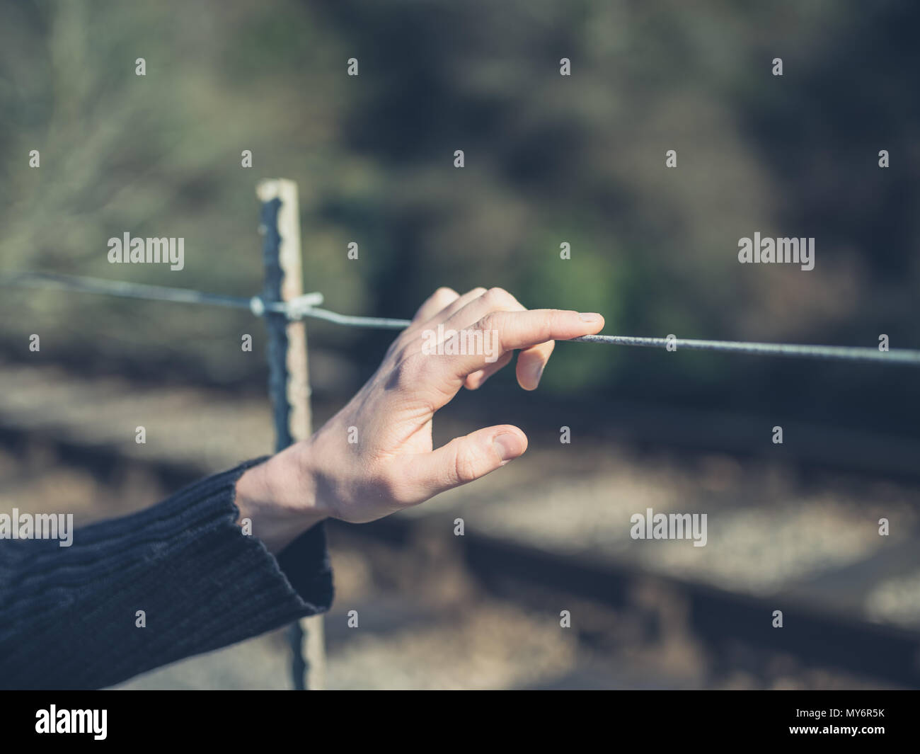 Touching the fence hi-res stock photography and images - Alamy