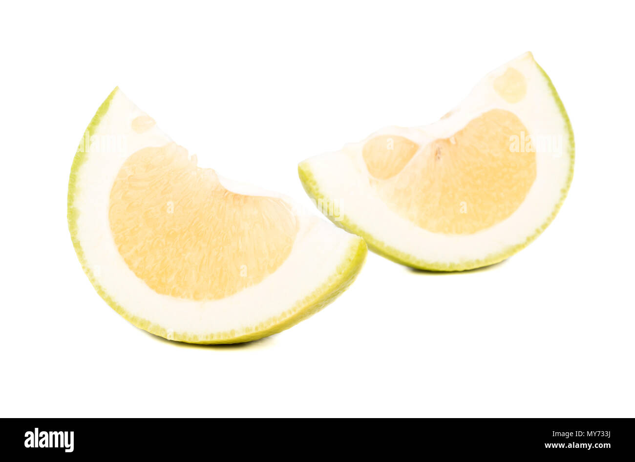 Two slices of fruit oroblanco on a white background Stock Photo - Alamy