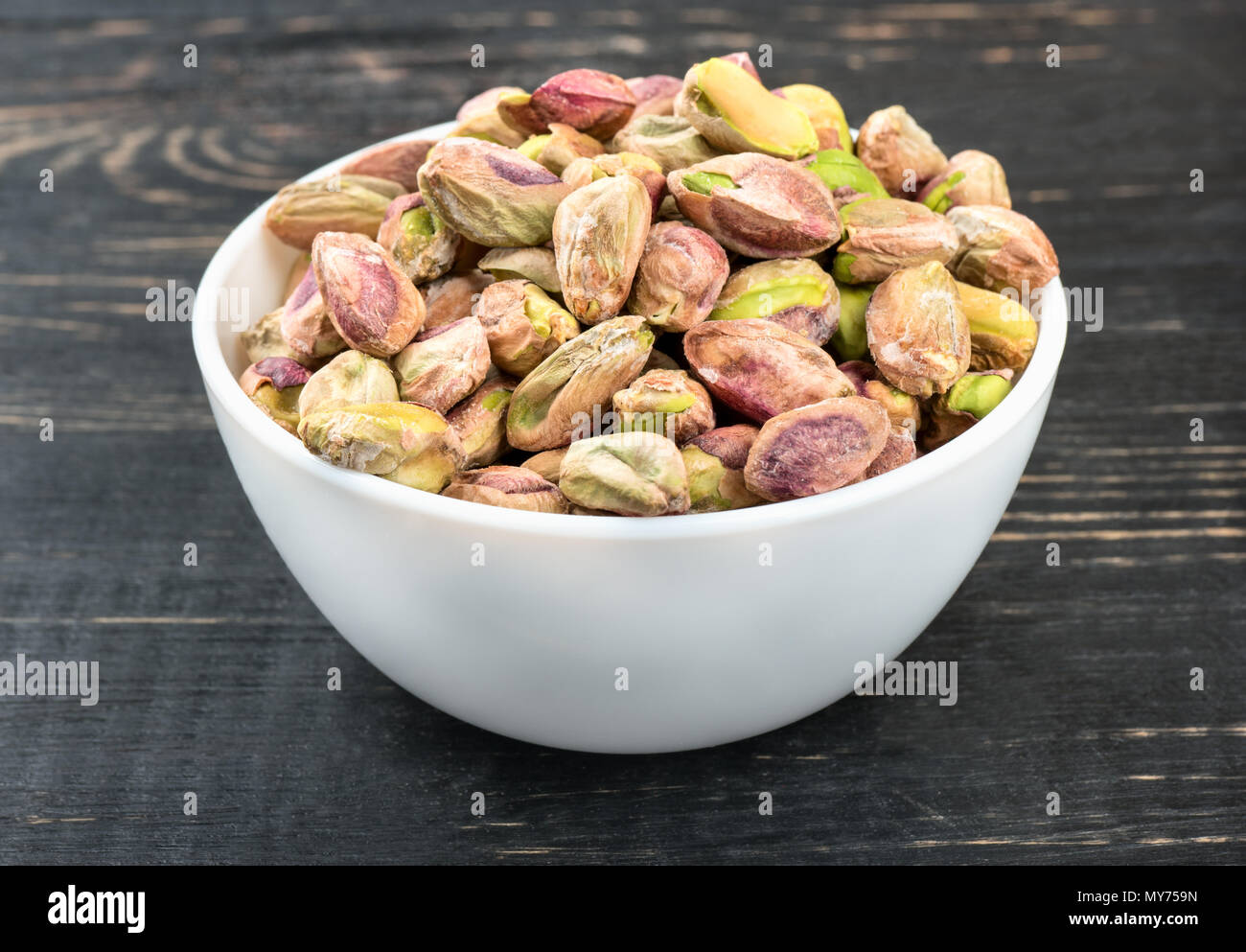 Pistachio nuts with and without shell hi-res stock photography and ...