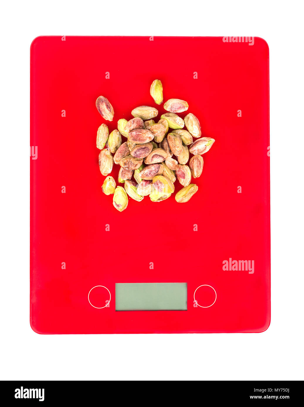 Pistachio nuts without shell on red scales on white background Stock ...