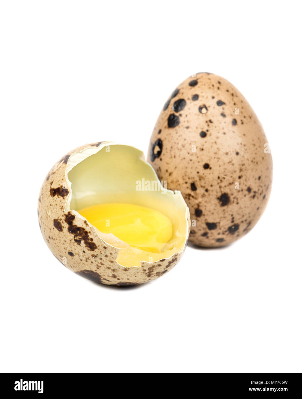 Raw broken quail egg on white background Stock Photo - Alamy