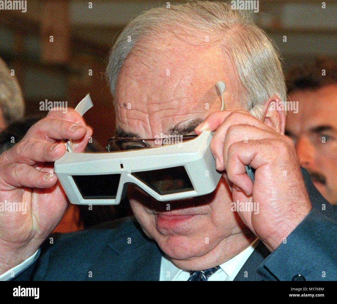 German Chancellor Helmut Kohl looking through 3D glasses at the opening ...