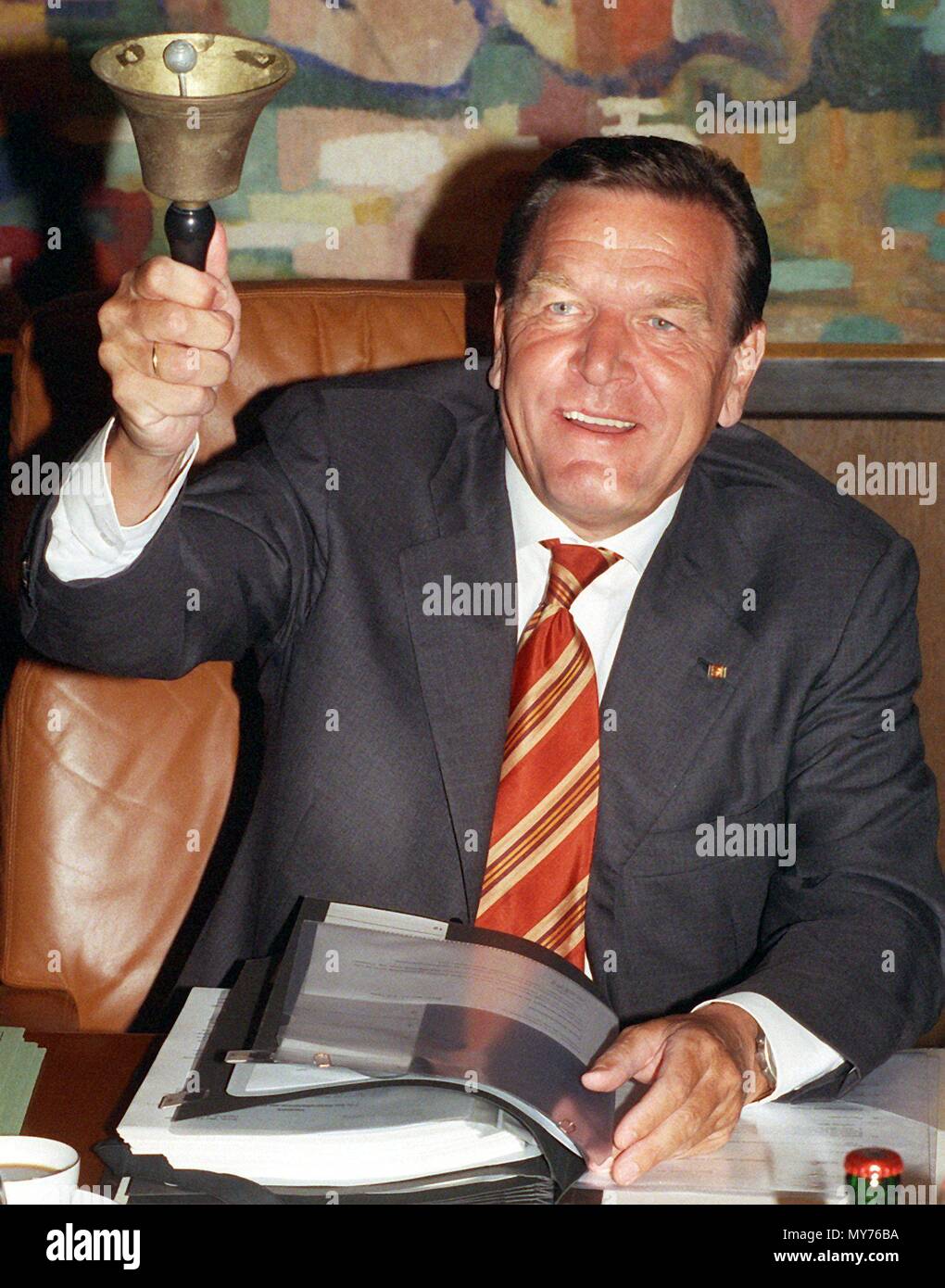 German Chancellor Gerhard Schroeder rings the bell at the final cabinet ...