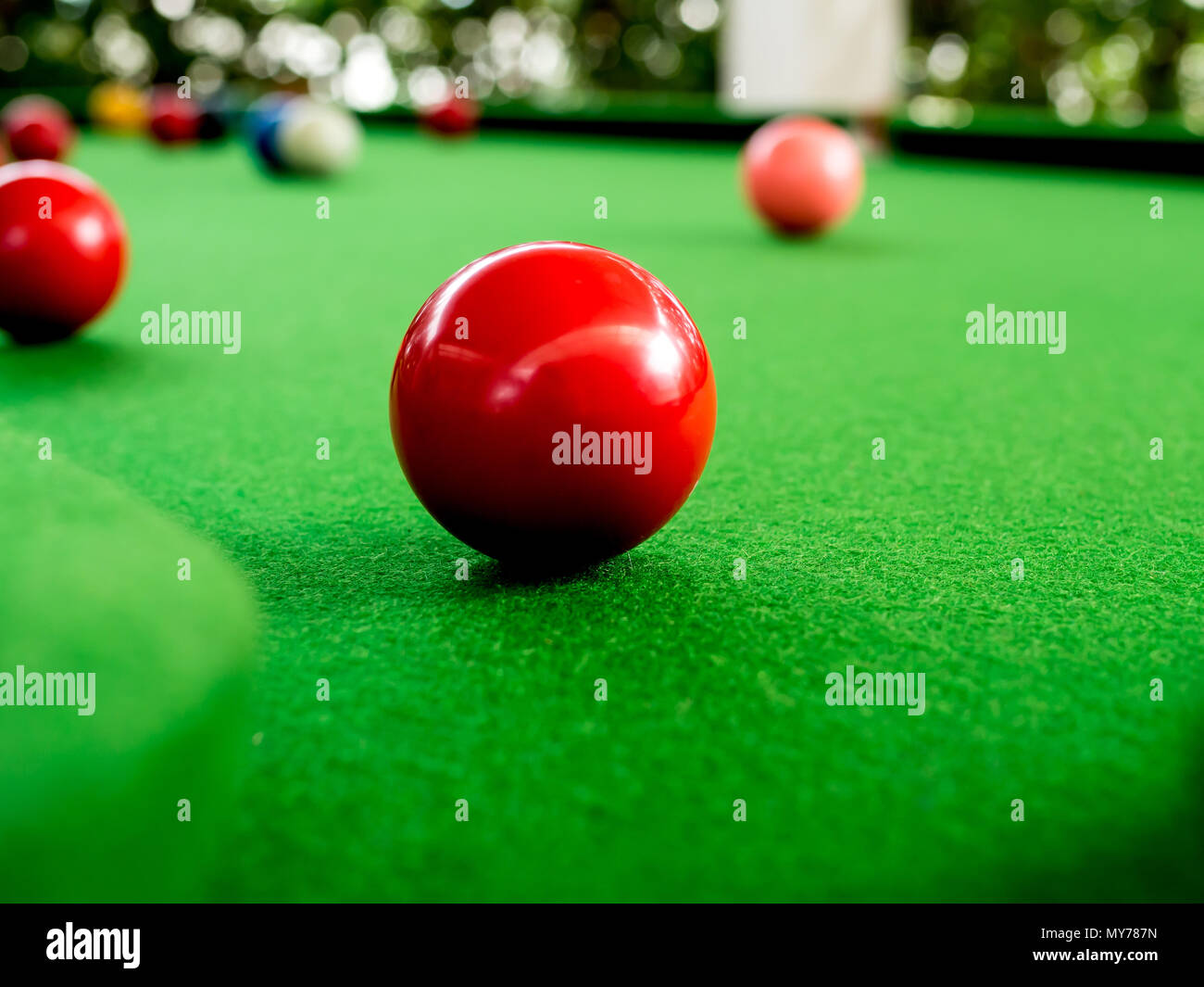 Red and Colorful Snooker Balls Near Corner Hole on Green Snooker Table ...