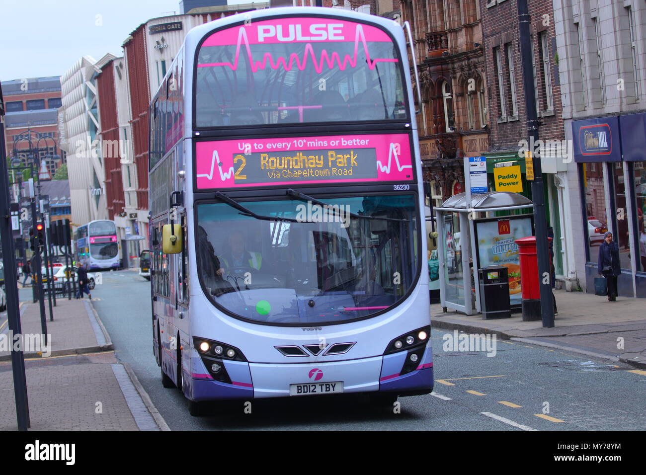 Buses on Eastgate in Leeds City Centre Stock Photo - Alamy