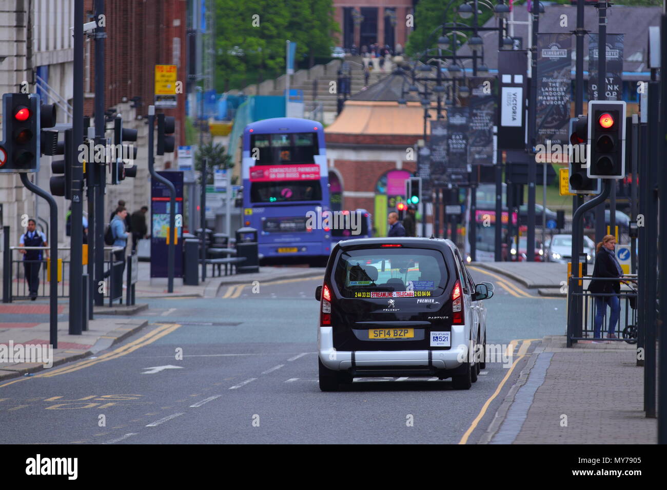 Buses on Eastgate in Leeds City Centre Stock Photo - Alamy