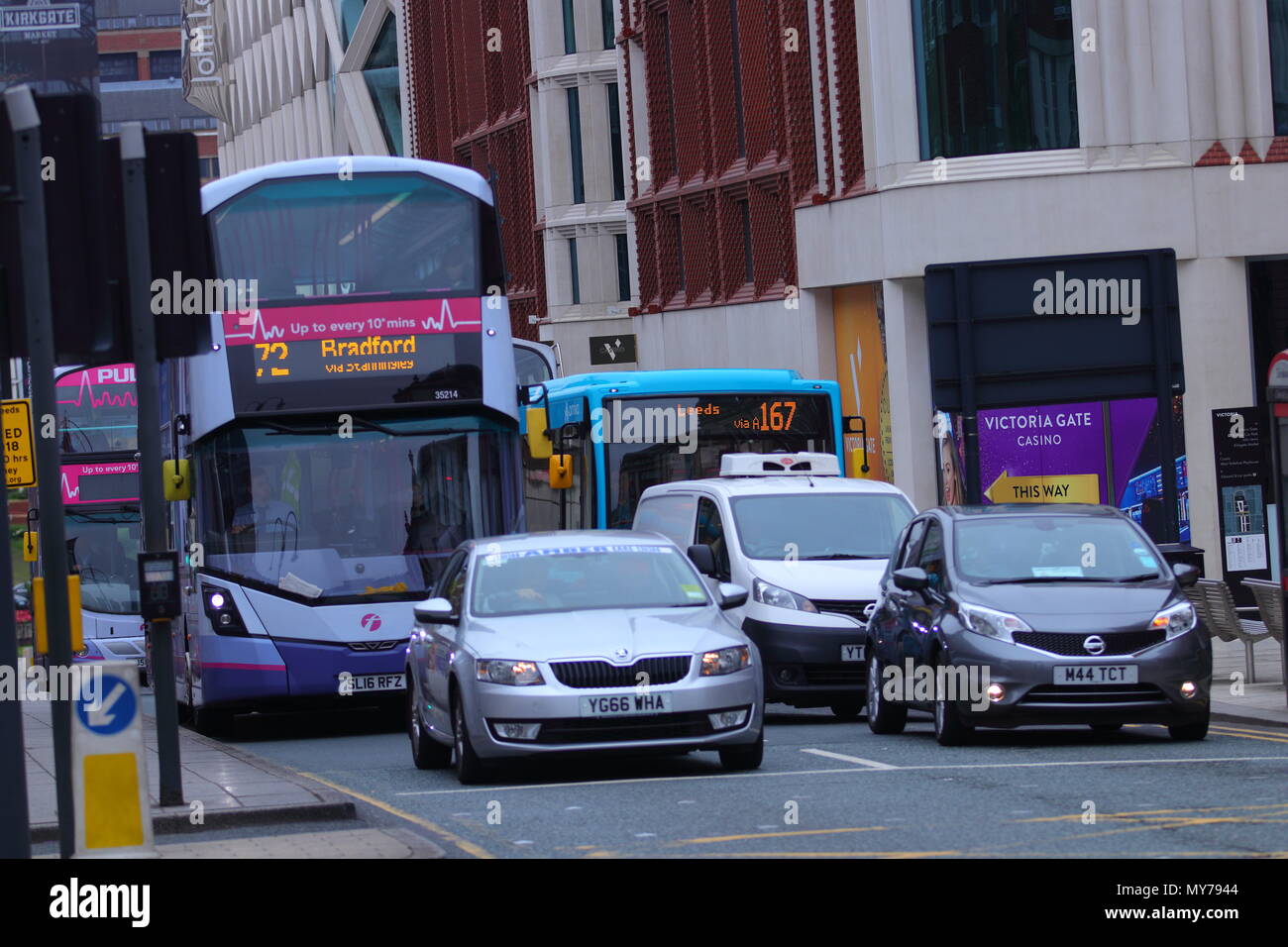 Buses on Eastgate in Leeds City Centre Stock Photo - Alamy