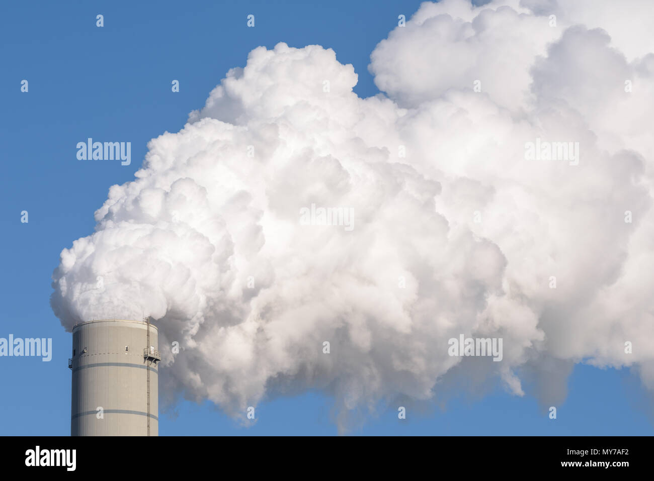 Close up of a smokestack of a fossil fuel coal power plant with white ...