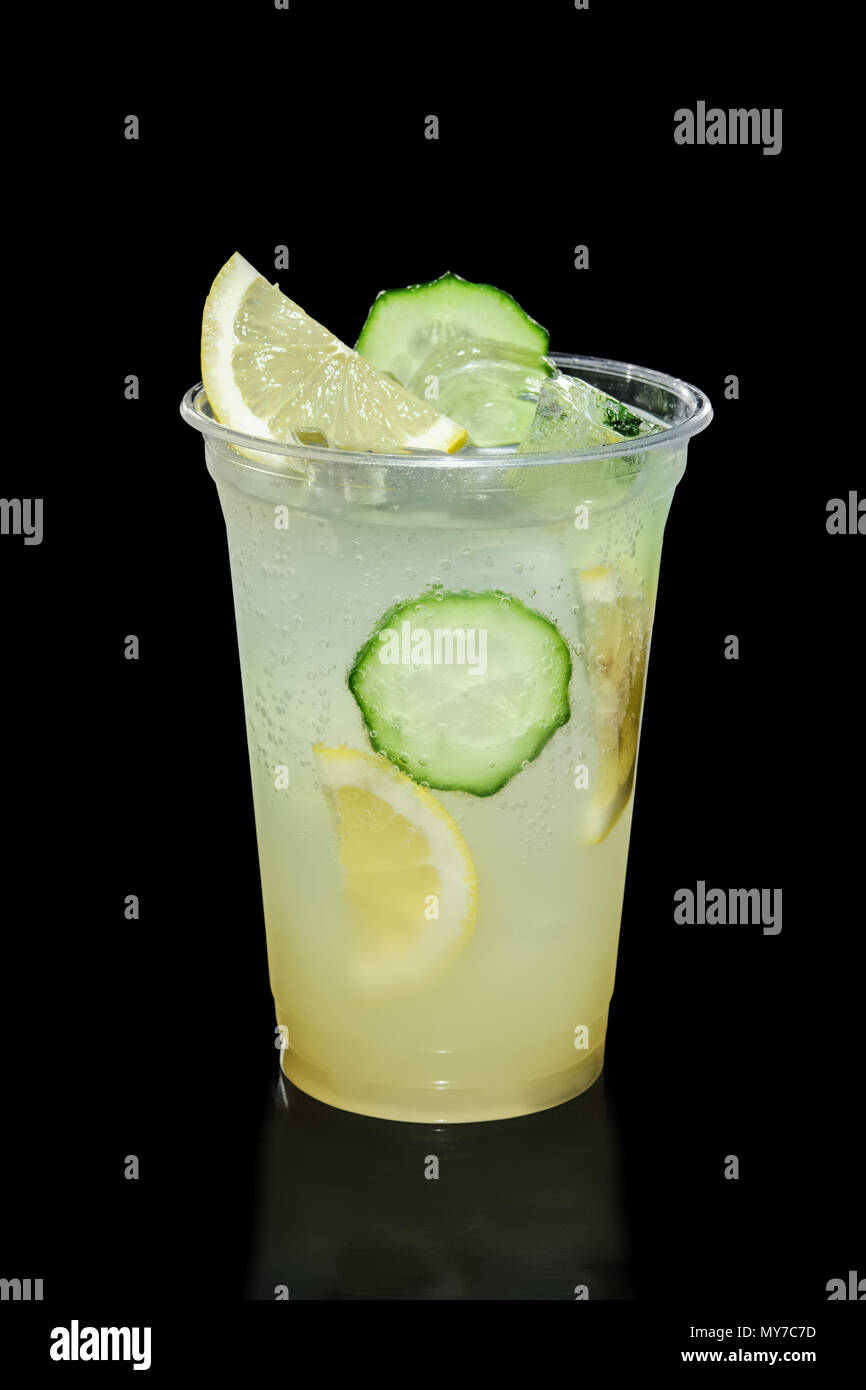 Take away glass with lemon and cucumber lemonade isolated on black ...