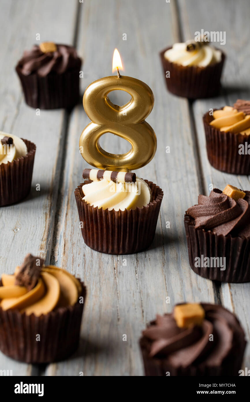 Number 8 celebration birthday cupcakes on a wooden background Stock ...