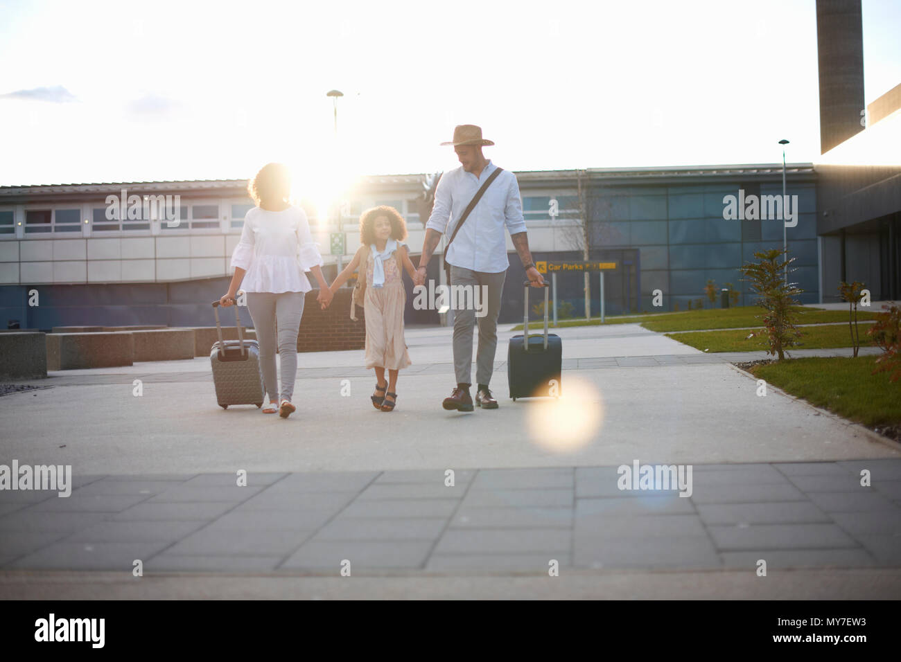 Family of three going on vacation Stock Photo - Alamy