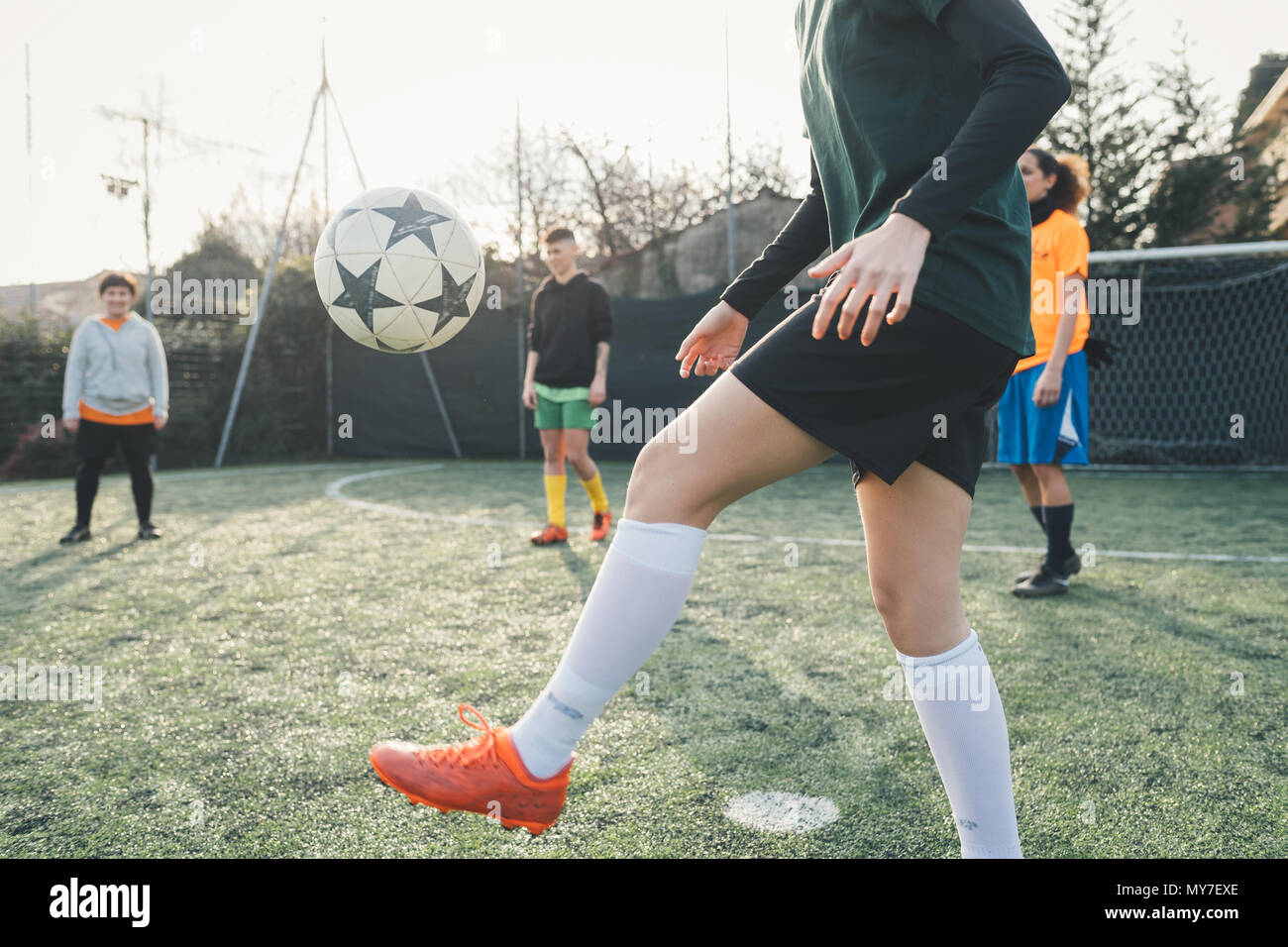 Football players playing on football pitch Stock Photo - Alamy