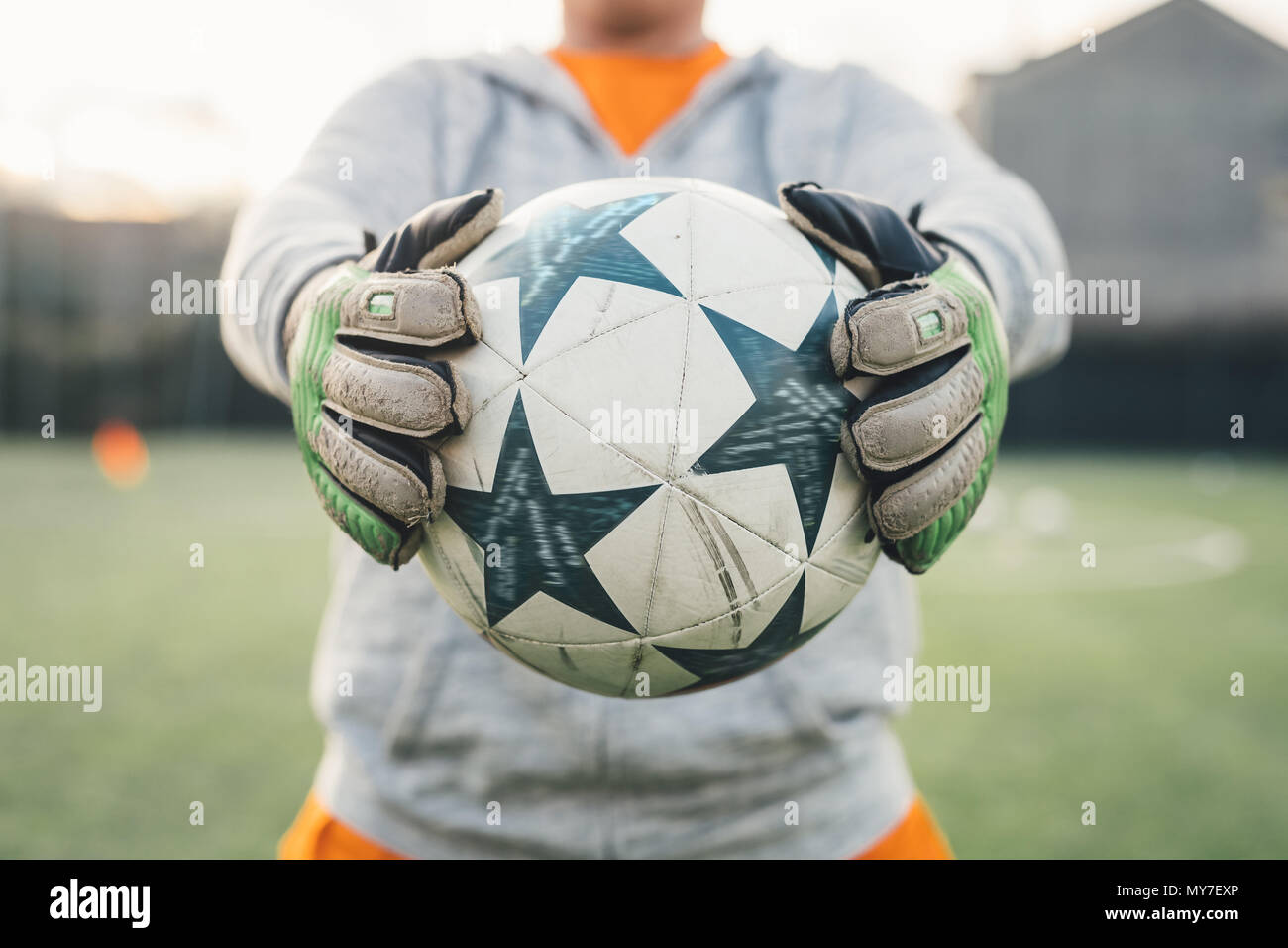 Woman holding soccer ball outdoors hi-res stock photography and images ...