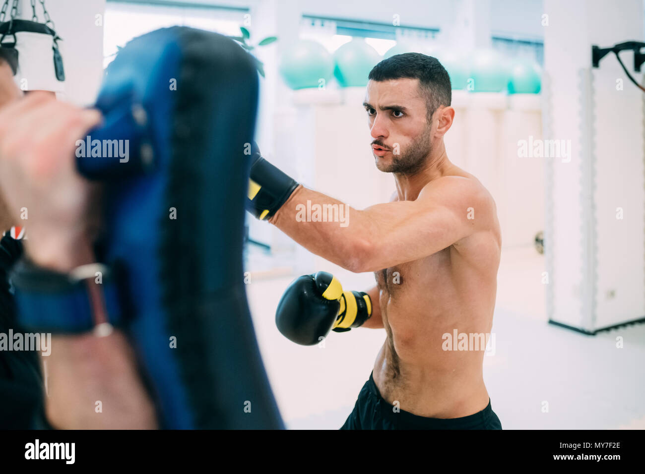 Man kickboxing training Stock Photo - Alamy