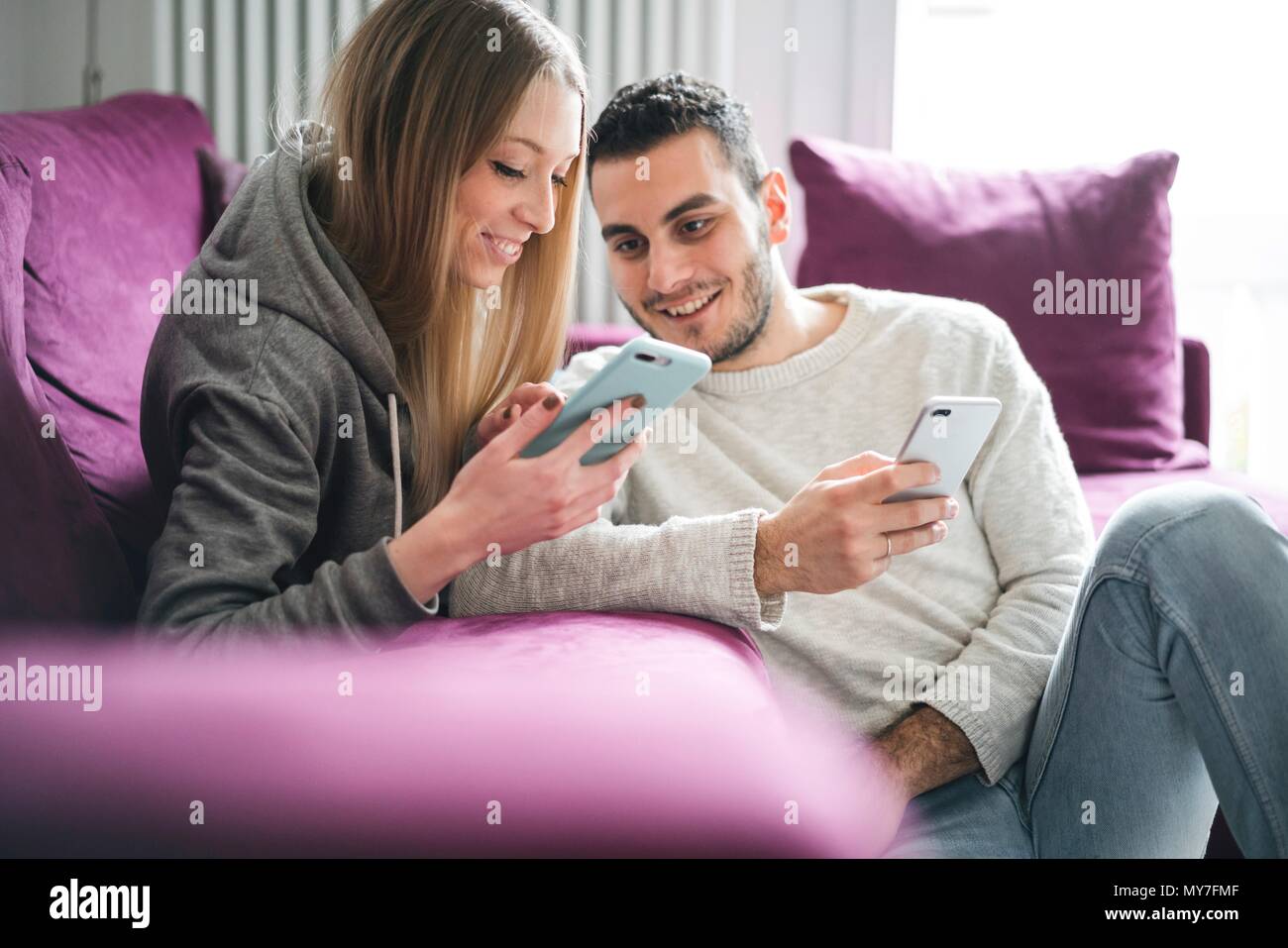 Sofa telephone couple hi-res stock photography and images - Alamy
