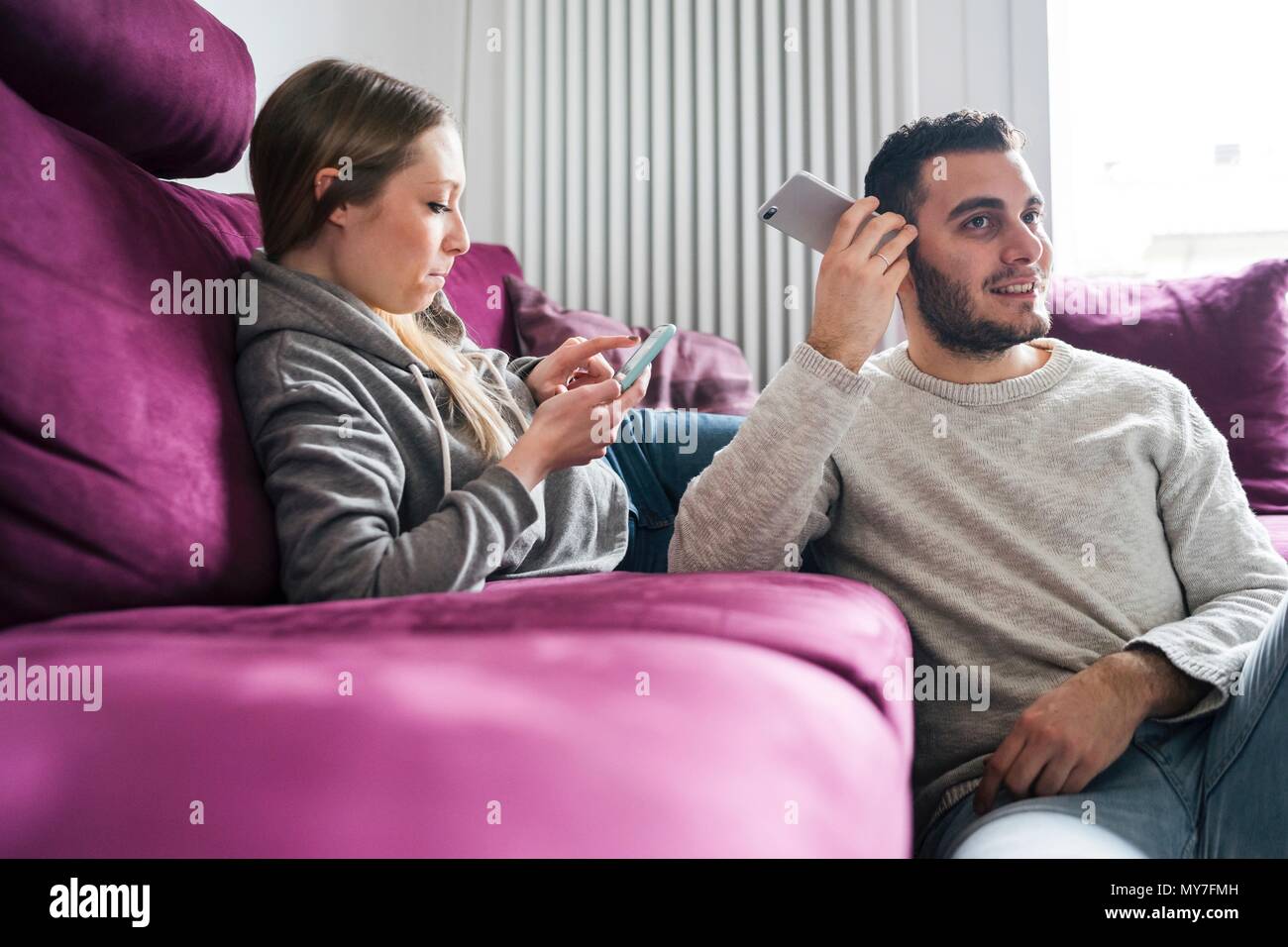 Sofa telephone couple hi-res stock photography and images - Alamy