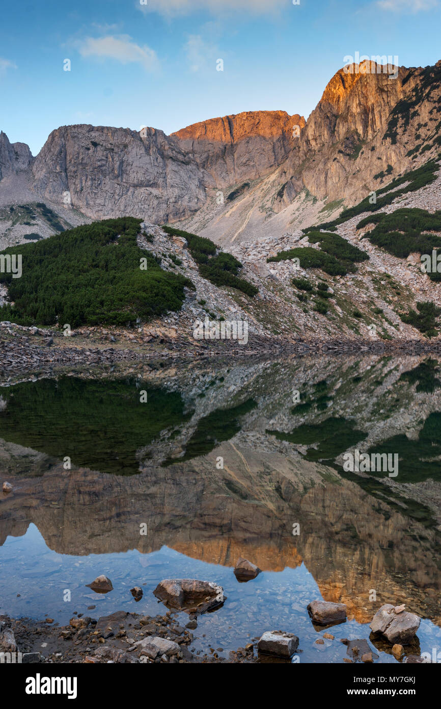 Amazing Sunrise with Colored in red rock of Sinanitsa peak and the lake ...