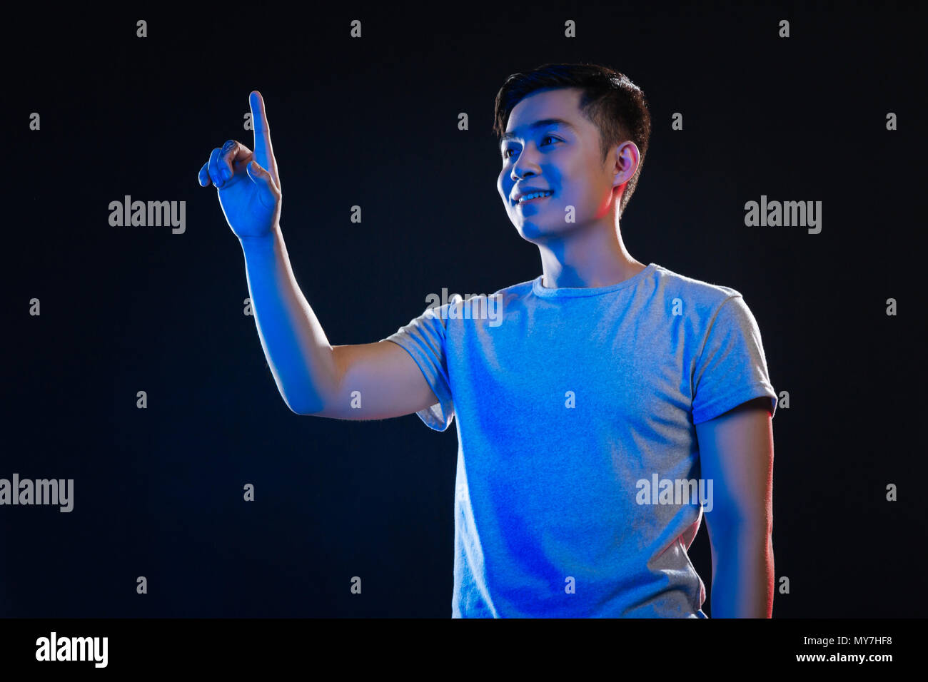 Positive happy man touching the sensory screen Stock Photo - Alamy Positive happy man touching the sensory screen Stock Photo - Alamy