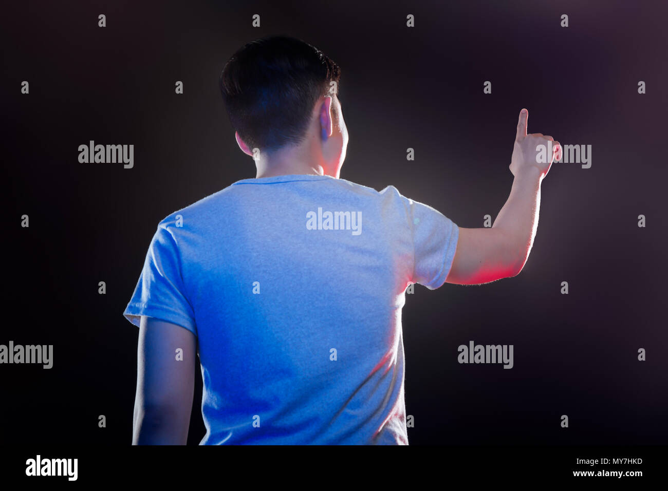 Smart Asian man turning on the screen Stock Photo - Alamy