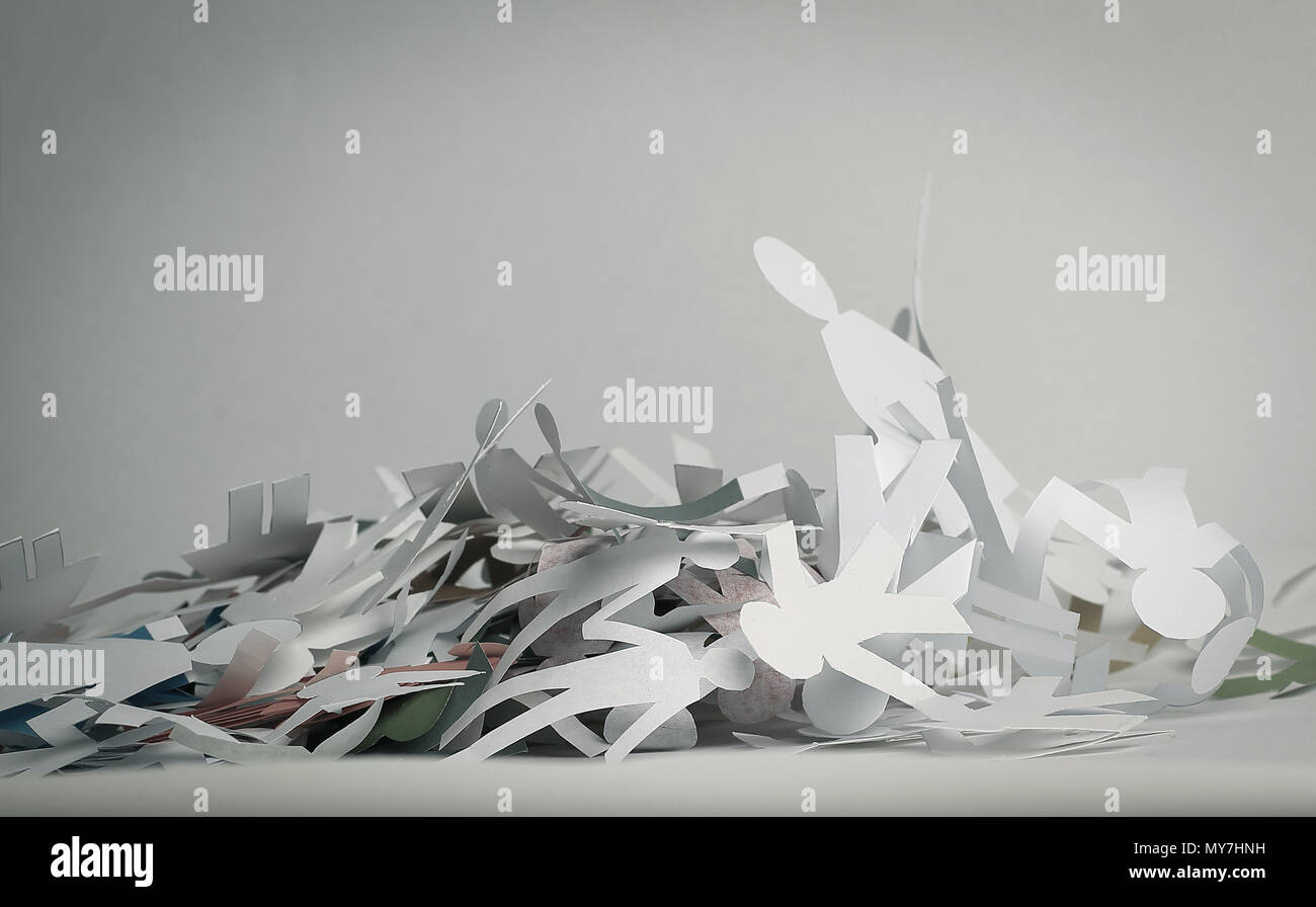 lot of paper men piled in a heap Stock Photo - Alamy