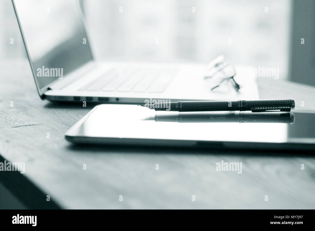 close up.fountain pen, tablet and laptop on the table.business ...