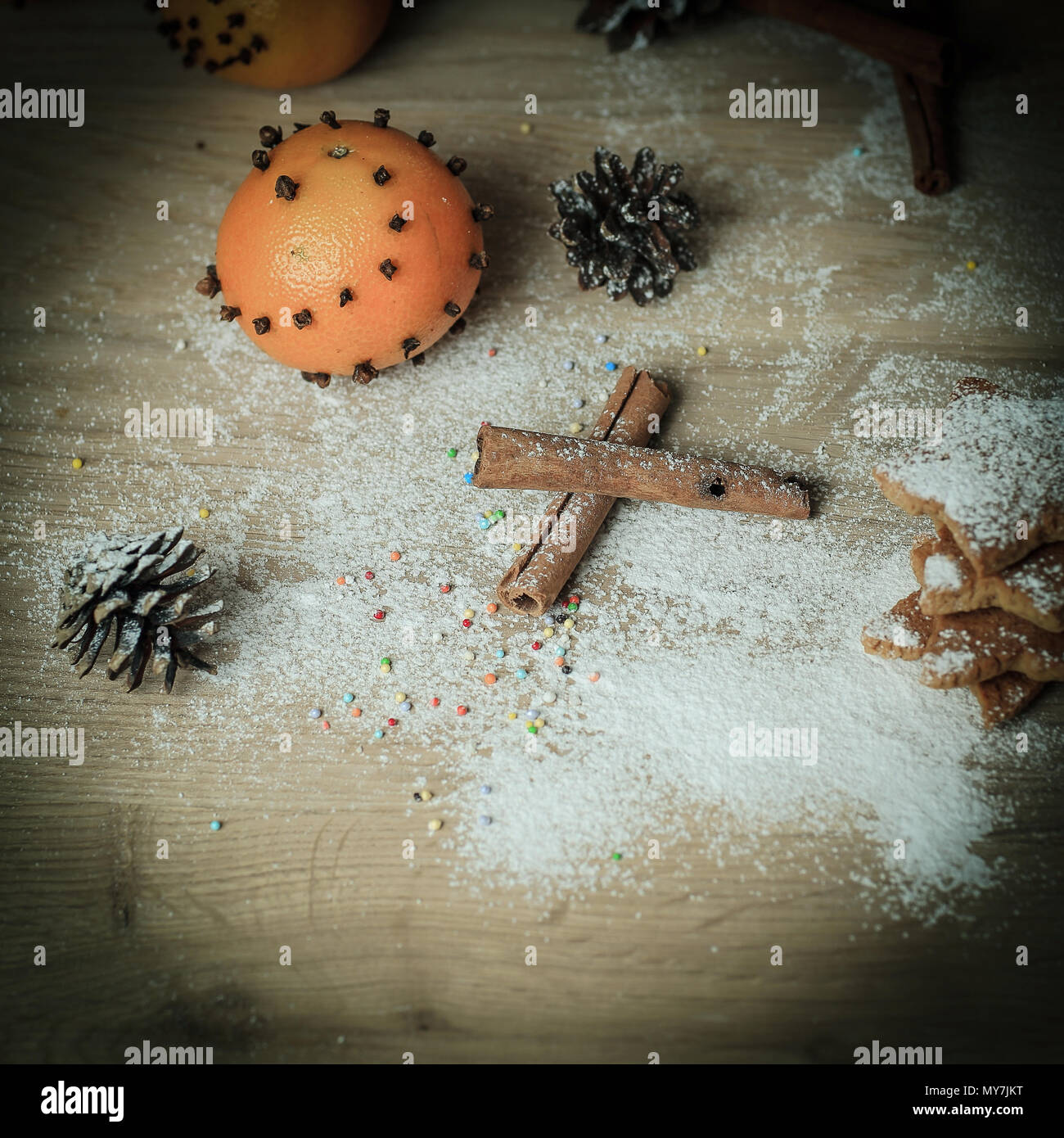 Christmas table. background image of cinnamon sticks,oranges an Stock ...
