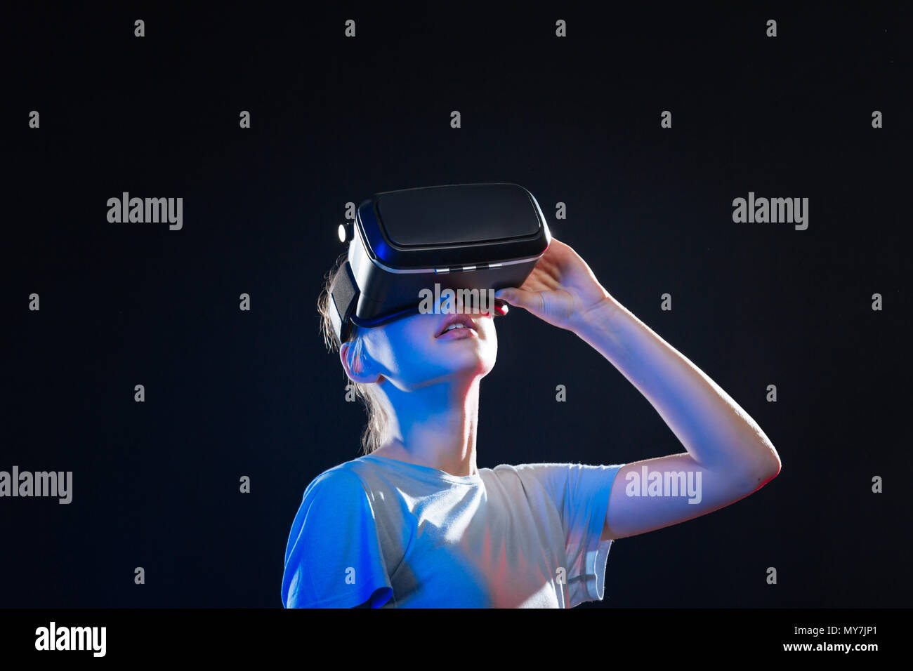 Nice young woman looking up Stock Photo - Alamy